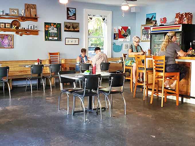Light streams through windows illuminating the caf&eacute;'s charming interior, where every corner feels thoughtfully arranged rather than designed.