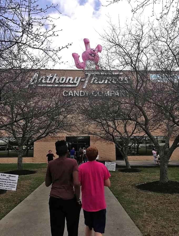 The pilgrimage to chocolate paradise begins &ndash; eager candy enthusiasts approach the famous shop, anticipation building with every step toward sweetness.