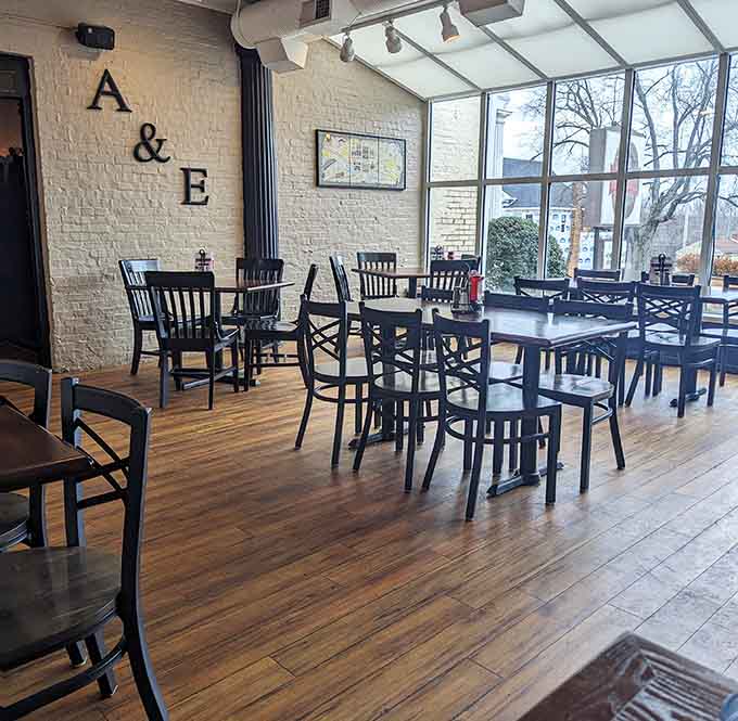 Large windows flood the dining room with natural light, creating a bright and welcoming space for any meal.