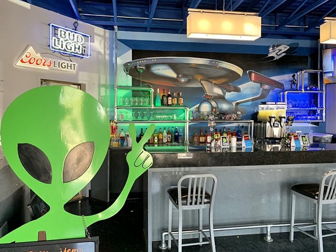 Where extraterrestrials and truckers alike can enjoy cold ones under the watchful eyes of a UFO suspended above the liquor bottles.