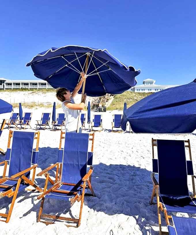 Beach day essentials: Those signature blue umbrellas and chairs await, promising hours of sun-soaked relaxation on sugar-white sands.