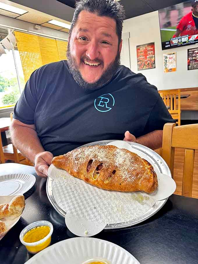 A golden-brown pocket of joy stuffed with molten cheese and fillings &ndash; like a pizza that decided to fold itself into a warm hug.