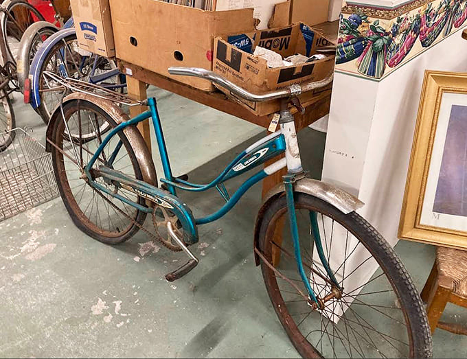 This classic red cruiser bicycle stands ready for new adventures &ndash; its vintage charm promising leisurely rides and neighborhood admiration.