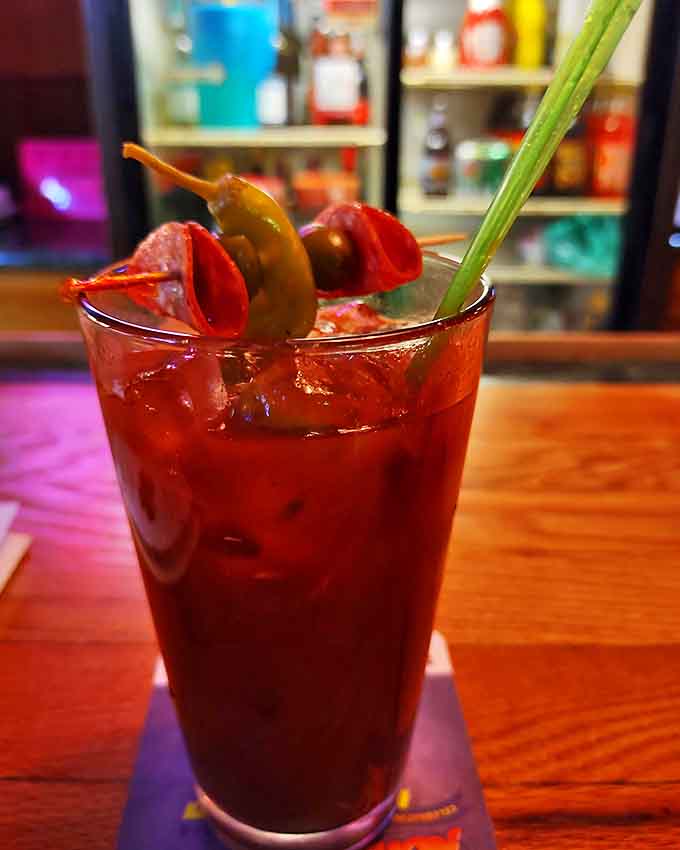 Their Bloody Mary comes fully loaded with garnishes, creating a drink substantial enough to count as an appetizer.