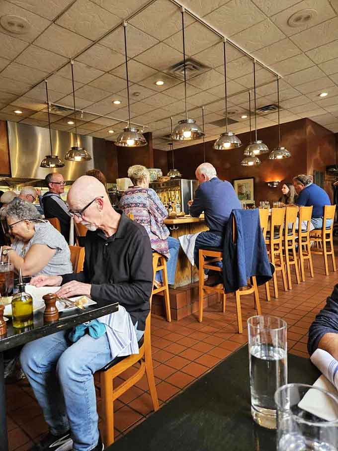 Diners enjoying their meals with the kind of focused intensity usually reserved for watching championship sports or solving crimes.