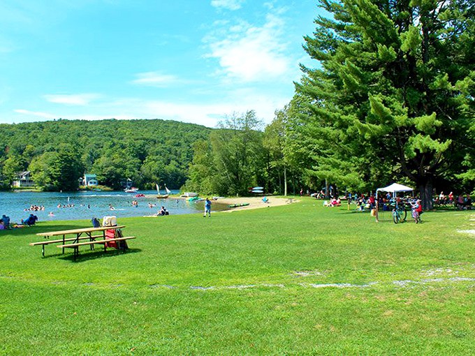 Lake St. Catherine's shores offer perfect picnic territory where families create memories against a backdrop of mountains and sky.