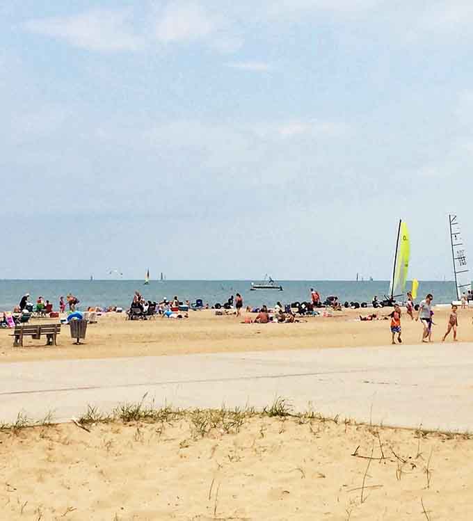 Caseville County Park's beach buzzes with summer energy – where sandcastles rise and fall with the tide of daily visitors.