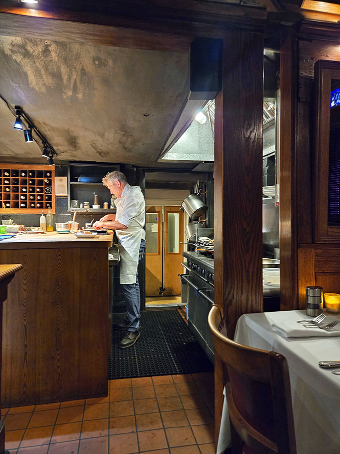 Watching the chef work in this tiny kitchen is like seeing a master craftsman create magic in a space most people use for storage.