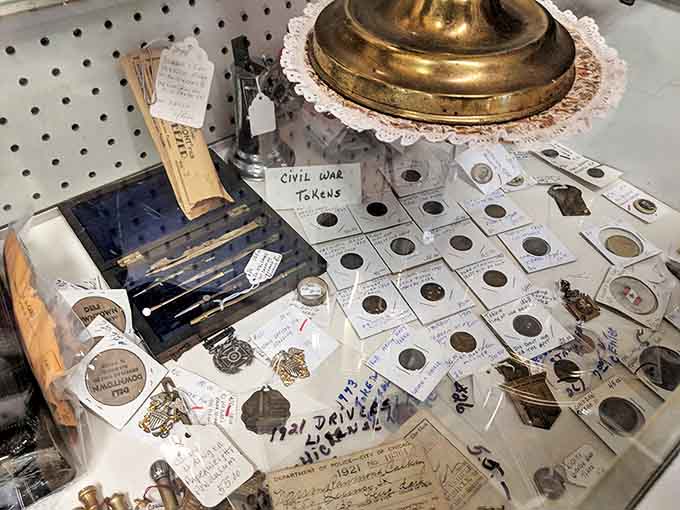 Civil War tokens and antique coins tell stories of commerce from another era, each tiny metal disc a tangible piece of history.