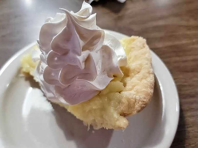 Coconut cream pie topped with a mountain of meringue &ndash; like biting into a tropical cloud that makes you temporarily forget your own name.