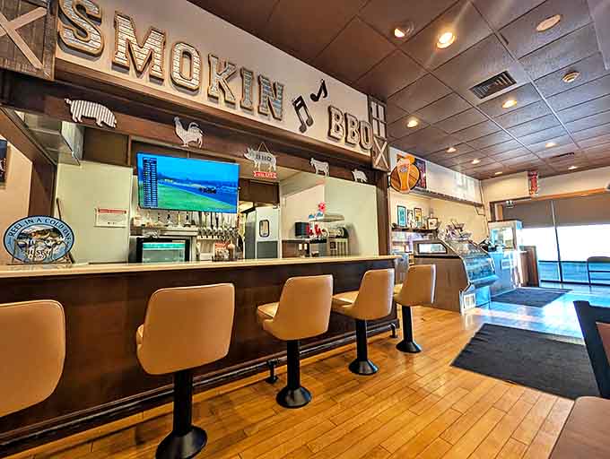 The counter where barbecue dreams come true, complete with rustic signage and animal silhouettes celebrating the sources of smoky goodness.