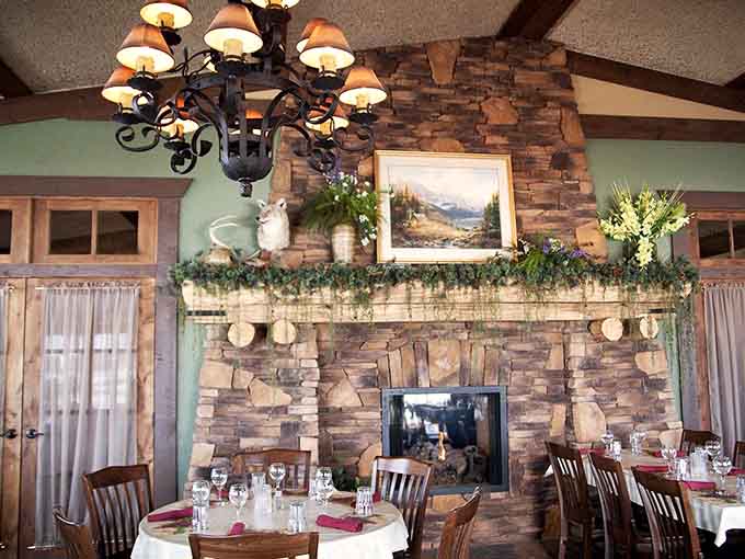 The stone fireplace adds rustic charm and cozy warmth, making this dining room feel like a Minnesota retreat.