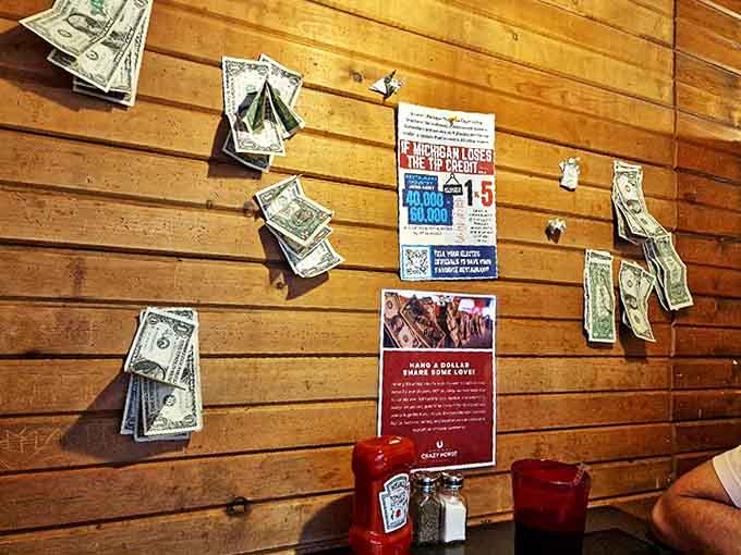 Dollar bills decorating wooden walls speak to the restaurant's quirky charm and loyal customer traditions.