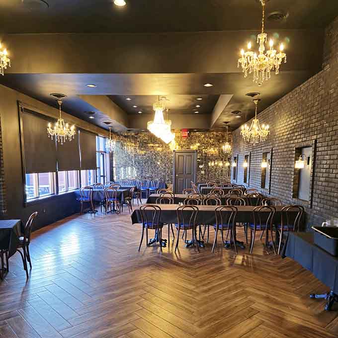 Crystal chandeliers and herringbone floors in the dining room elevate the supper club experience without making it stuffy or pretentious.
