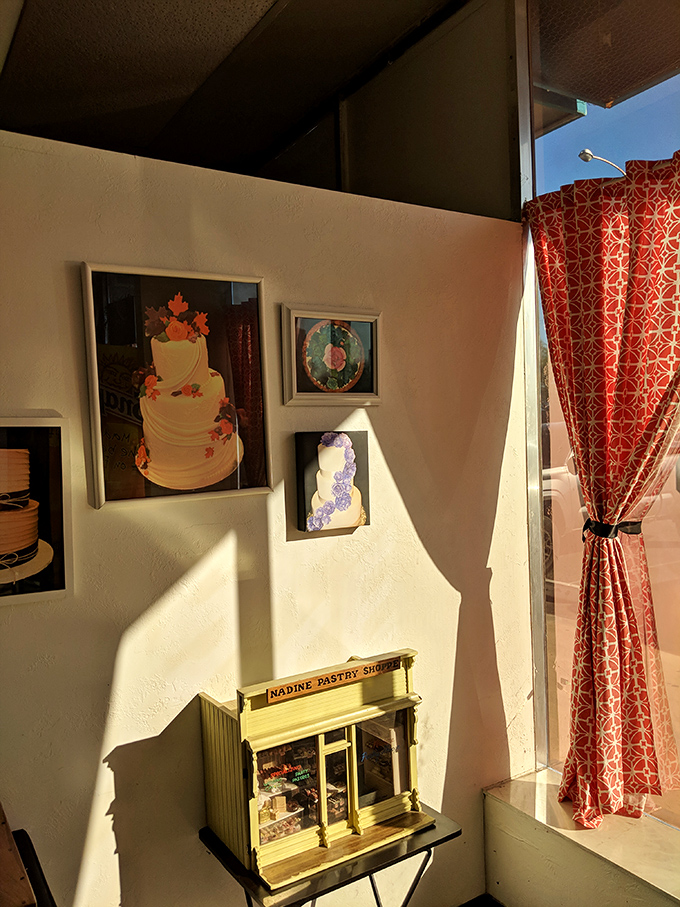 Framed cake photos serve as both decoration and evidence that yes, they really can make your wedding cake look like that.