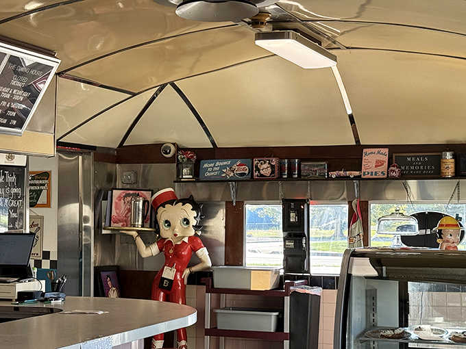 Betty Boop stands guard near vintage signs &ndash; silent witnesses to decades of satisfied customers and countless "best meal ever" declarations.