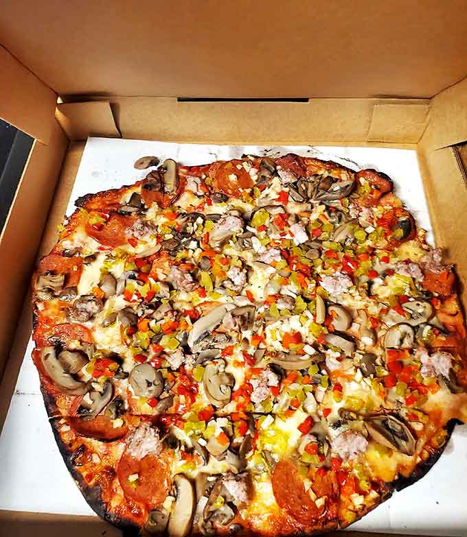 When you can't decide on toppings so you say "yes" to everything – a democratic approach to pizza where every ingredient gets a vote.