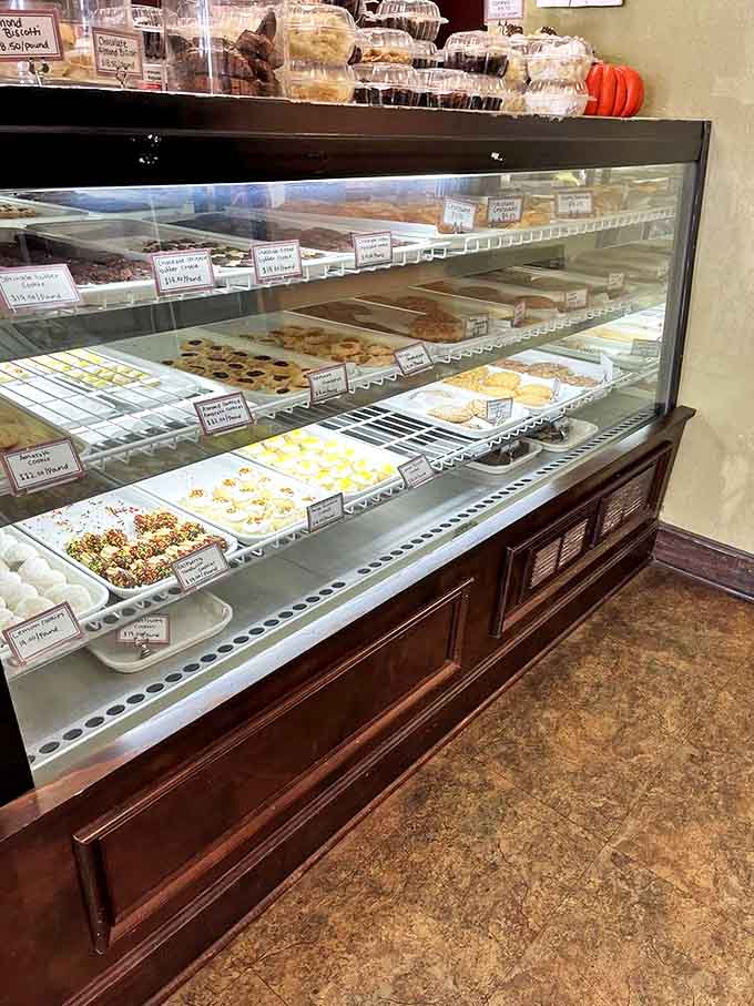 The glass barrier between impulse and indulgence, showcasing edible art that makes museum exhibits seem boring by comparison.