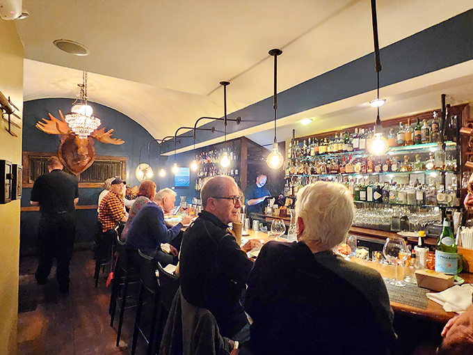 The bar area buzzes with energy as patrons enjoy the convivial atmosphere &ndash; proof that great food tastes even better in good company.