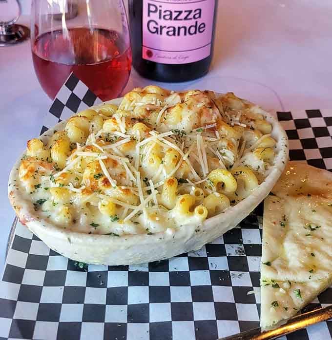 Mac and cheese served in a bread bowl, because carbs deserve to hang out with other carbs.