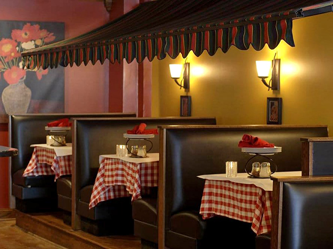 Red-checkered tablecloths and cozy booths create an atmosphere that's part nostalgia, part comfort, and entirely welcoming to hungry diners.