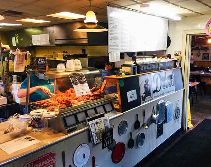 Behind that counter, the kitchen crew works their magic while fresh chicken waits for its moment of glory.