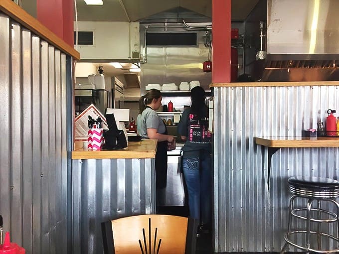 Behind the scenes, the kitchen staff works with practiced efficiency, turning fresh ingredients into memorable meals for hungry diners.
