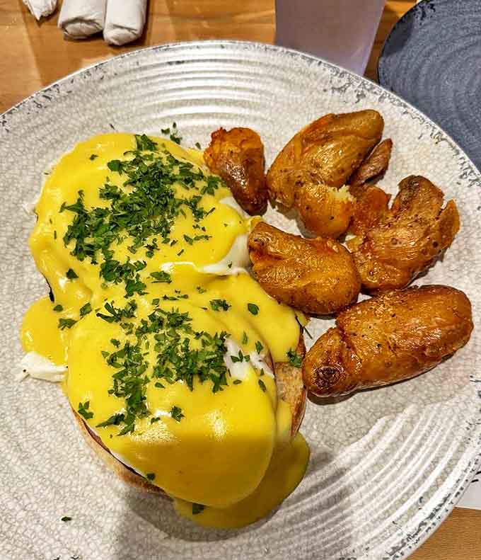 Eggs Benedict with perfectly poached eggs and golden hollandaise sauce, because brunch without this classic feels like something's missing from the universe.