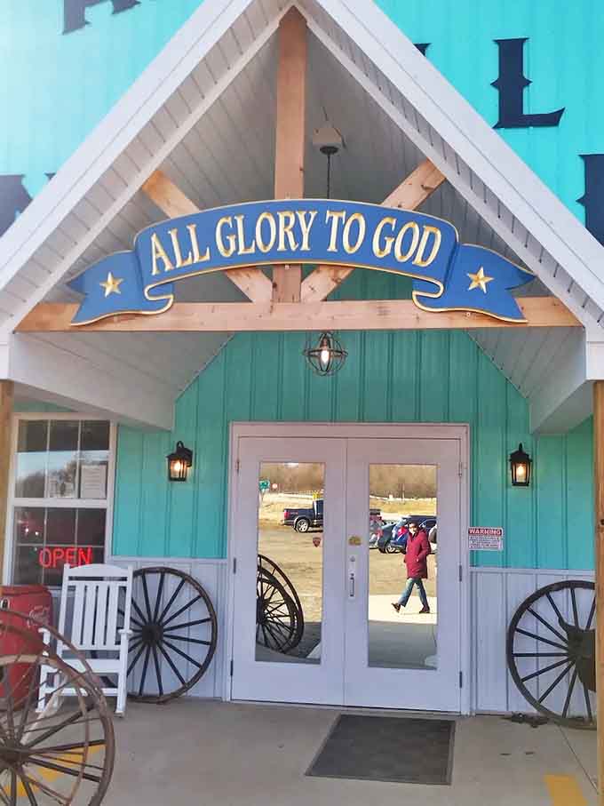 All Glory to God proclaims the entrance, where wagon wheels and rocking chairs invite visitors to slow down and step back in time.