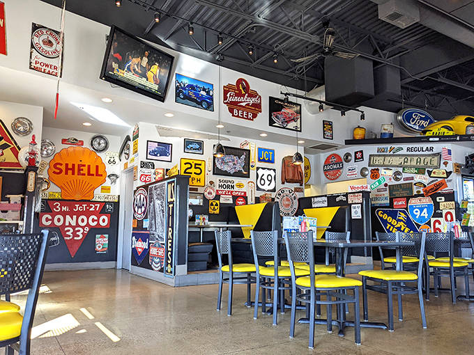 Every corner tells a story at Fat Willy's, where vintage gas station signs and automotive memorabilia transform dining into a nostalgic road trip.