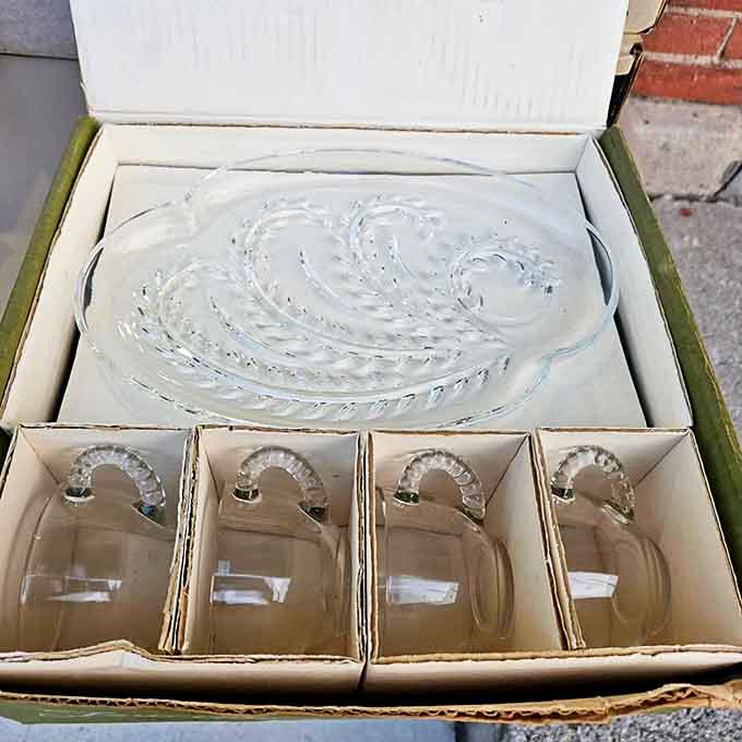 Boxed glassware sets preserved in their original packaging &ndash; like time capsules of entertaining from an era when serving punch was a social necessity.