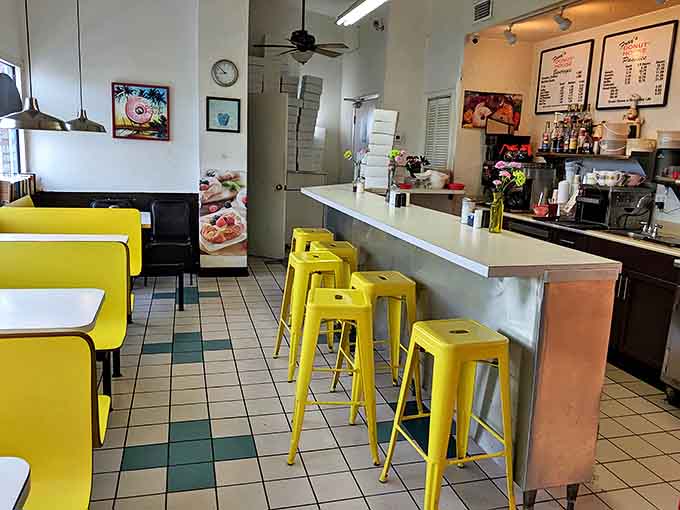 Yellow stools and clean lines give Fray's dining area a timeless quality. This isn't about trendy d&eacute;cor &ndash; it's about creating a space where donuts take center stage.