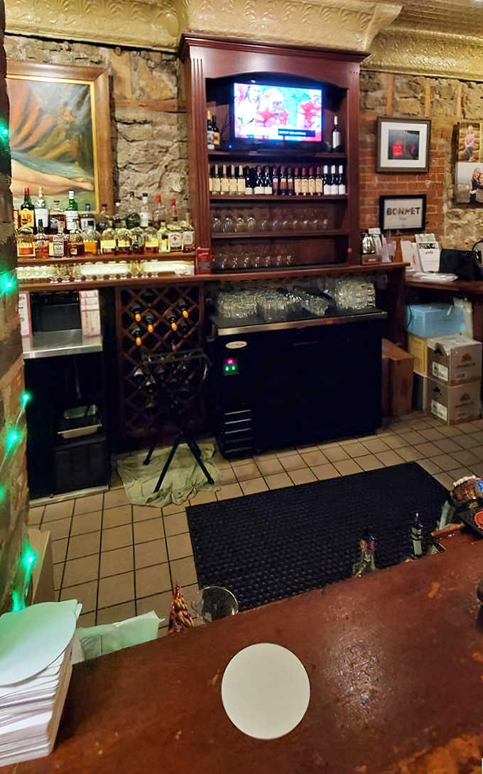 Bottles stand at attention like soldiers guarding liquid treasures, ready to enhance your meal with perfectly paired potions.