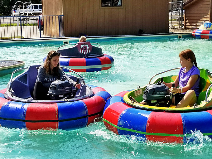 Young visitors navigate bumper boats with varying degrees of skill, engaging in spirited water battles. The genuine control offered by these boats makes for an engaging experience.