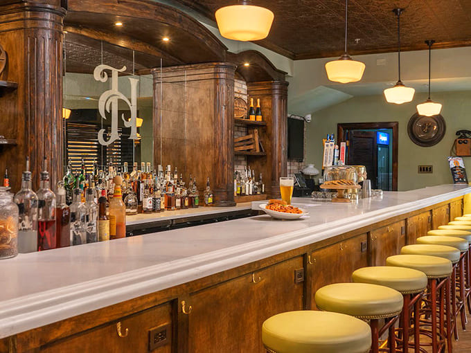 The bar area provides adults a sophisticated space to unwind, complete with craft cocktails and the kind of ambiance that says "the kids are entertained elsewhere."