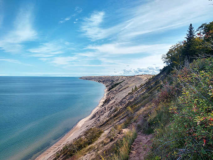 Grand Sable Dunes rise dramatically above the shoreline, a surprising landscape of windswept sand perched atop the already impressive cliffs.