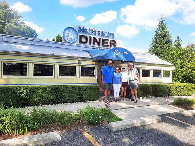 Happy visitors pose outside their discovery, that universal look of people who've just experienced something authentic in a world of reproductions.