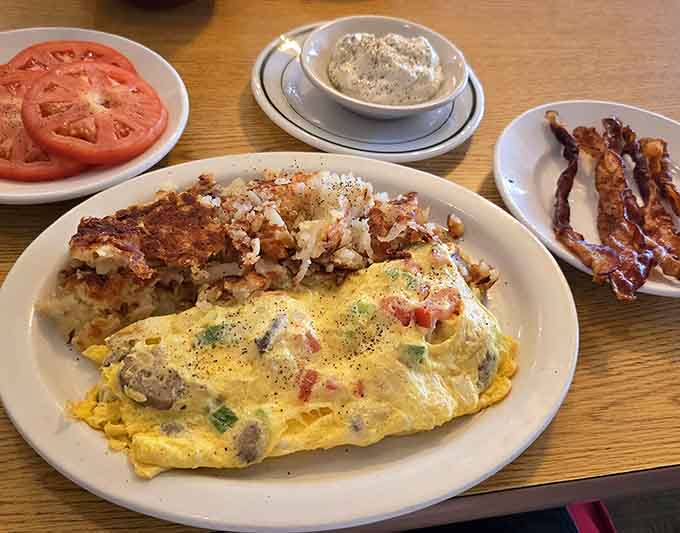 This omelet is stuffed so full of delicious ingredients that it's practically bursting with breakfast joy and melted cheese.