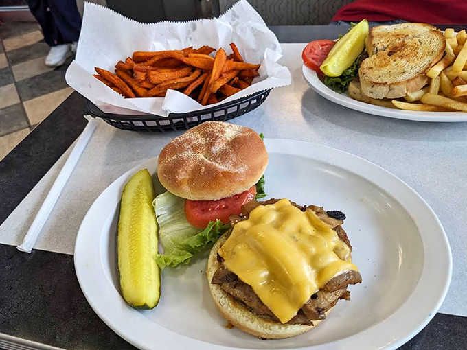 Juicy, cheese-crowned perfection with that essential pickle spear standing guard &ndash; a burger that means serious business.