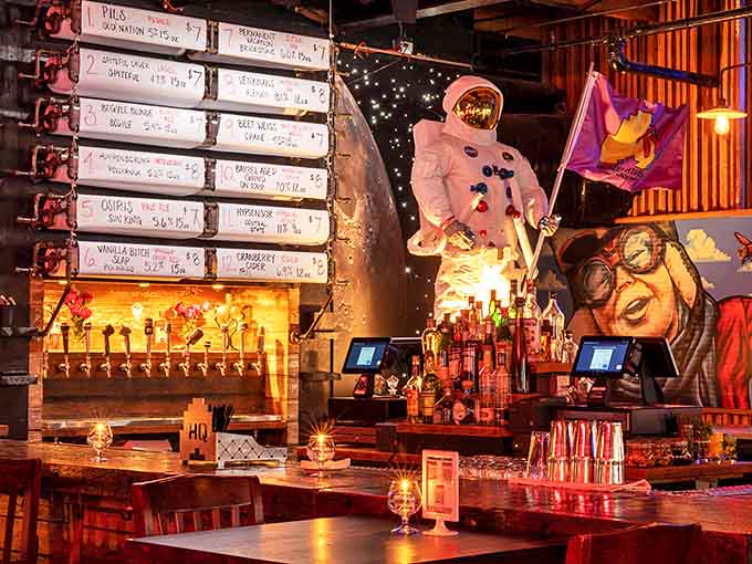The bar glows with possibility, where craft beers flow freely and the ghostly astronaut mascot watches over the proceedings with approval.