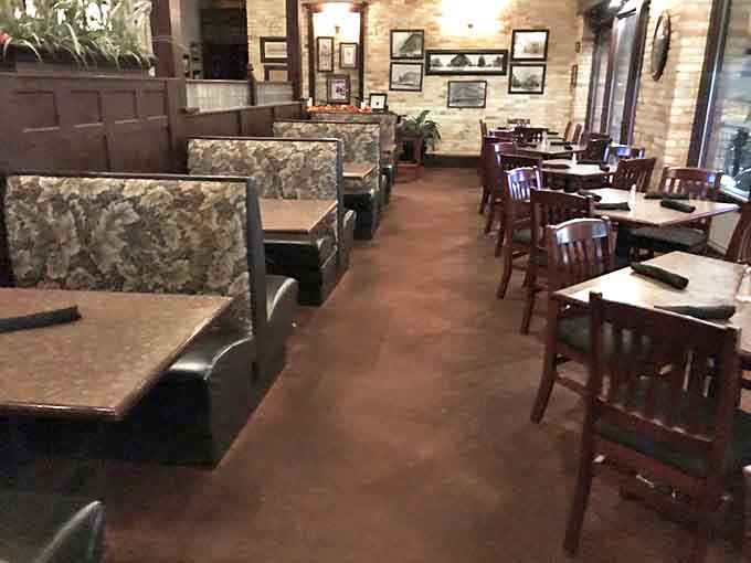 Comfortable booths and well-spaced tables create an intimate dining environment where conversations flow as easily as the wine.