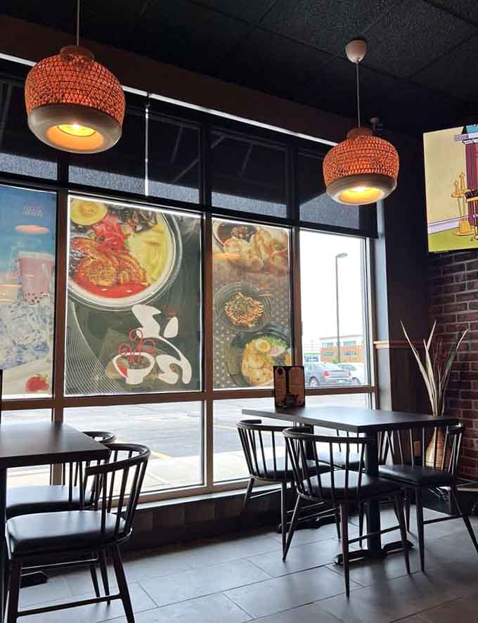 Large windows flood the space with natural light, creating a bright, welcoming environment that feels both modern and cozy.