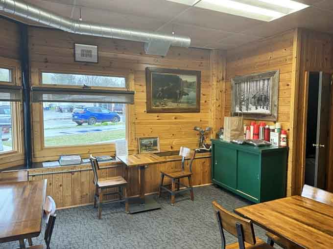 Another angle of this welcoming space reveals simple wooden tables where strangers become friends over shared cookie appreciation.