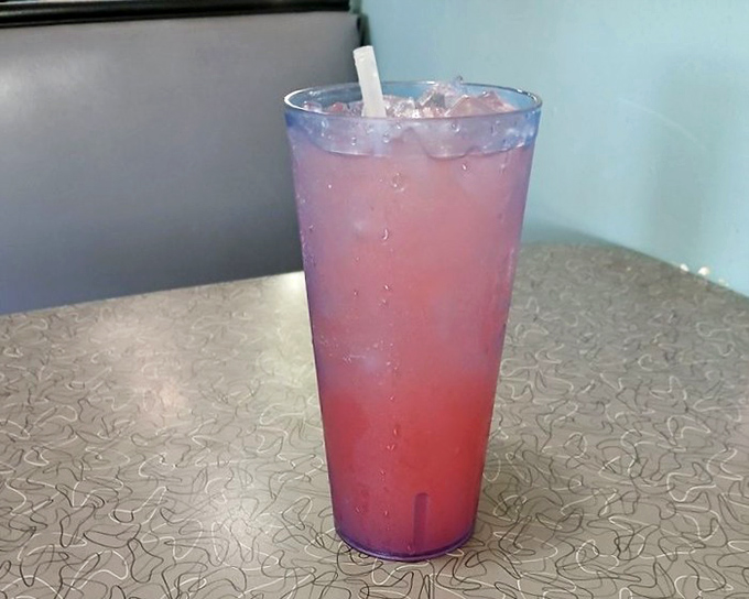 The pink lemonade at Mel's isn't just a drink – it's liquid sunshine in a glass, the perfect sweet-tart companion to hearty diner fare.