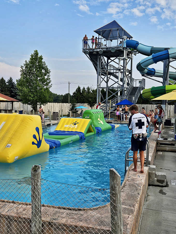Safety first! A vigilant zone captain watches over swimmers, ready to ensure everyone's day remains splash-filled rather than splash-too-filled.