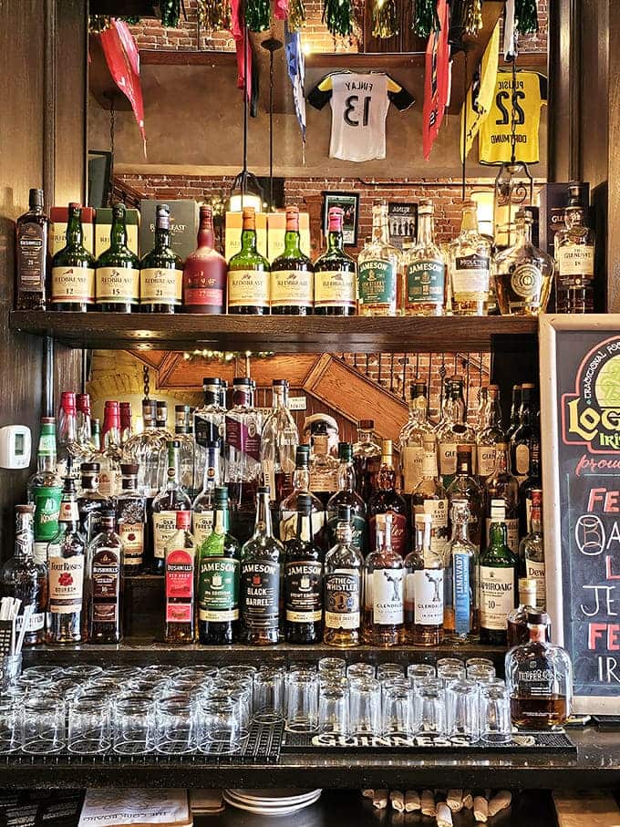 An impressive whiskey selection lines the shelves like liquid gold, offering everything from smooth Irish classics to bold American bourbons worth savoring slowly.