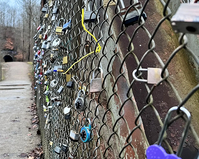 Love locks adorn the bridge fencing &ndash; each padlock representing a personal story against the backdrop of a much older tale.