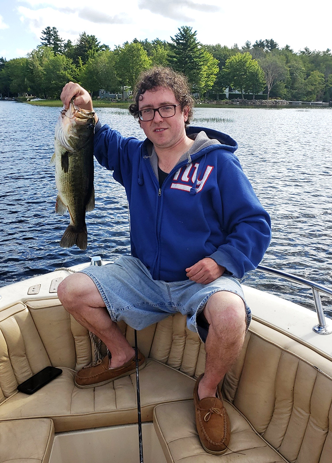 Fishing success! Damariscotta Lake delivers for anglers of all skill levels, with bass, perch, and pickerel waiting beneath the surface.