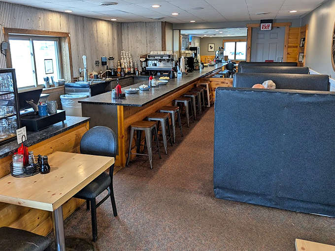 The counter seating offers front-row views of breakfast theater, where regulars exchange news while waiting for their usual orders.