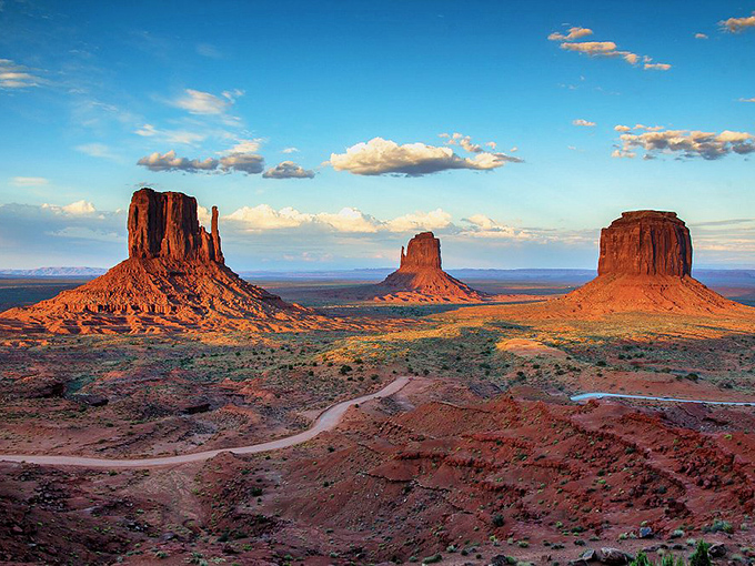 Monument Valley's iconic buttes stand like ancient skyscrapers, their silhouettes instantly recognizable even to those who've never visited Arizona.